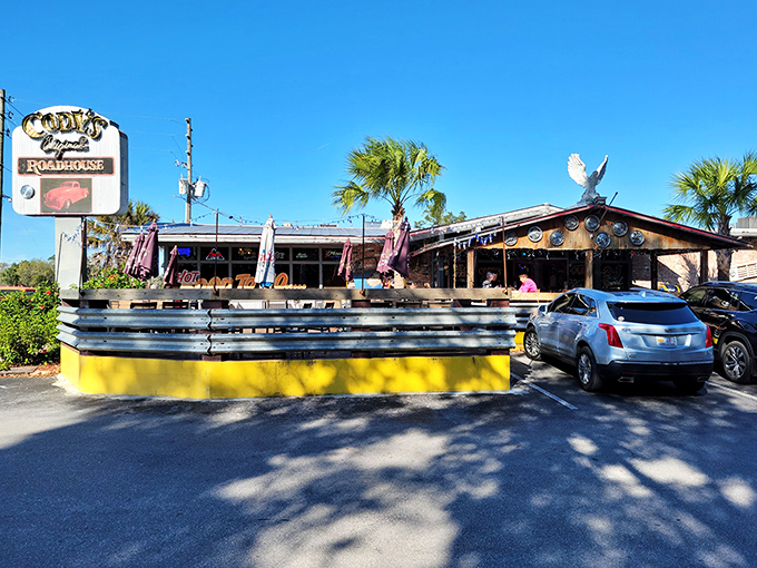 The iconic yellow exterior and corrugated metal trim of Cody's Original Roadhouse stands as a beacon for hungry travelers seeking authentic roadhouse fare in Crystal River.