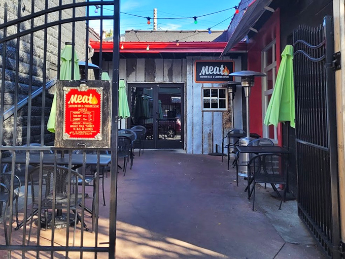 Push past the iron gate and follow the trail of smoke&mdash;inside waits a carnivore&rsquo;s dream, where rustic vibes and bold red accents set the stage for serious barbecue.