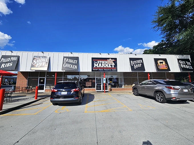 Strip mall exterior that houses barbecue gold &ndash; sometimes the best treasures hide in plain sight.
