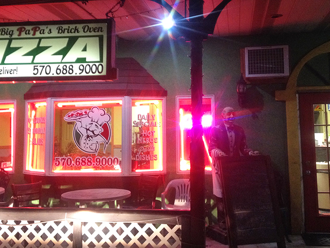 The neon glow of Big PaPa's at night isn't just a beacon for hungry travelers&mdash;it's a promise of brick oven perfection waiting inside.