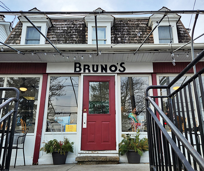 Bruno's charming exterior beckons with its red awnings and inviting porch &ndash; like a neighborhood friend waving you over for breakfast and good conversation.