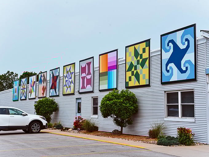 Quilt blocks as art! These vibrant panels on Yoder's exterior are like a gallery show for fabric lovers passing by.