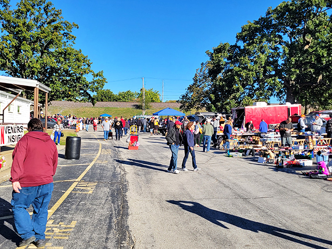 The treasure hunt begins where endless rows of vendors create a shopper's paradise under Missouri's blue sky.