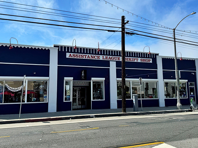 The navy blue fa&ccedil;ade of Assistance League Thrift & Vintage stands proudly on Long Beach Boulevard, a beacon for treasure hunters and bargain enthusiasts alike.