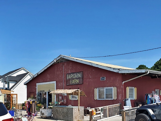 The iconic red exterior of Bargain Barn stands proudly against the Carolina blue sky, promising treasures within that big box stores could never deliver.