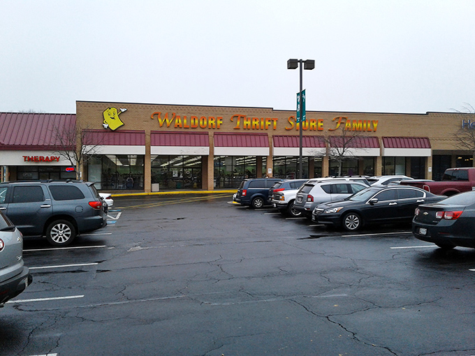 The unassuming storefront of Waldorf Thrift Store Family beckons with its cheerful yellow sign, promising treasures within that big-box retailers can only dream about.