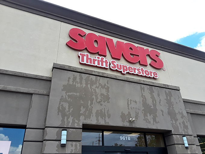 The iconic red Savers sign beckons like a lighthouse for bargain hunters. Your treasure hunt begins the moment you pull into this suburban shopping center.