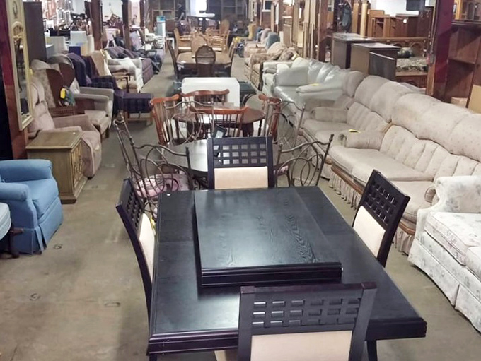Row upon row of wooden treasures await new homes at Sweet Repeats, where yesterday's furniture becomes tomorrow's family heirlooms.