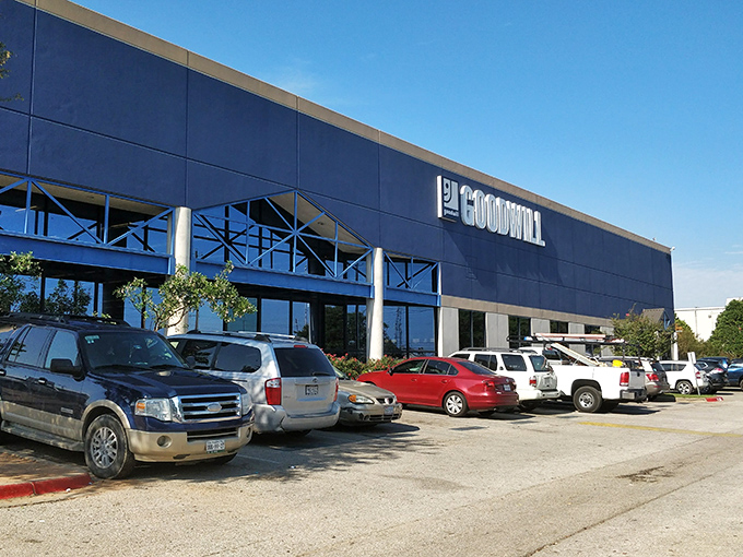 The blue-fronted facade of Goodwill Outlet South stands like a treasure chest waiting to be opened. Austin's bargain hunters know this isn't just any thrift store.