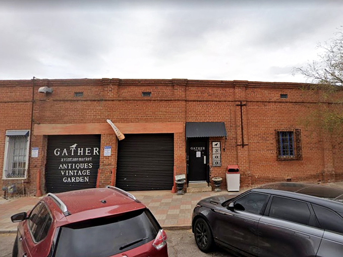 The unassuming brick exterior of Gather hides a universe of vintage treasures within, like a time-travel portal disguised as a warehouse in Tucson.
