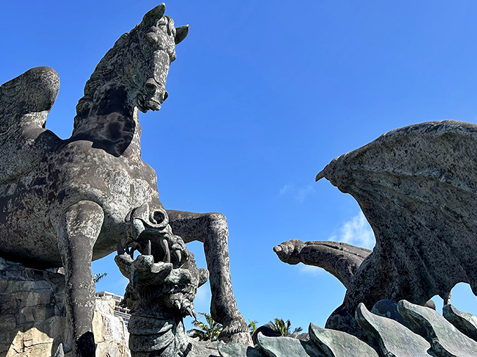 The ultimate mythological showdown! Pegasus and dragon locked in eternal bronze combat, creating Florida's most unexpected roadside photo op.