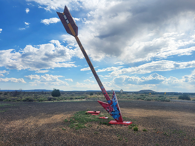That magnificent arrow stands like a desert sentinel, pointing toward adventures only Route 66 can deliver.