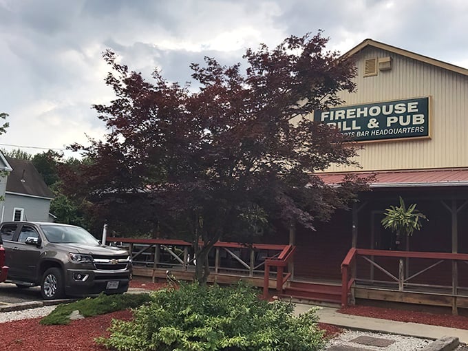 The red exterior of Rootstown Firehouse Grille & Pub stands like a beacon for hungry travelers, promising comfort and satisfaction within its welcoming walls.