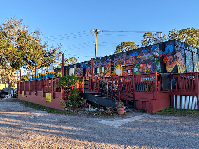The vibrant murals adorning this unassuming BBQ joint are like a smoke signal to your stomach: extraordinary flavors await inside.