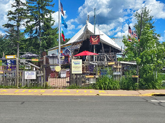 Not your average entrance! Tom's Burned Down Cafe embraces its phoenix-from-the-ashes origin story with a gloriously ramshackle facade that screams "adventure inside."