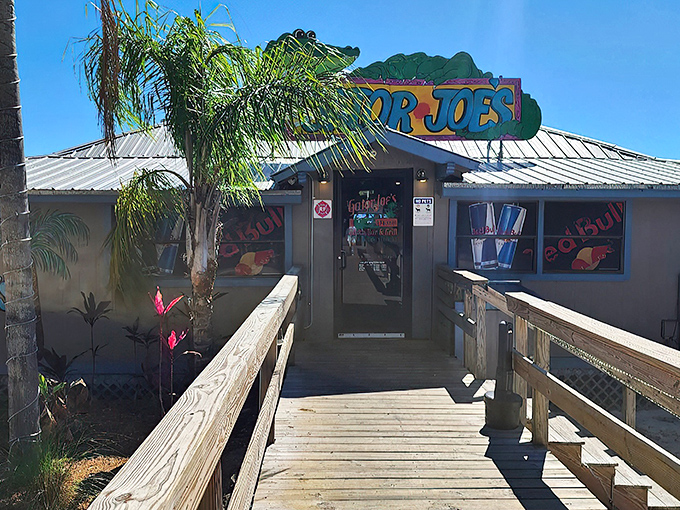 The wooden walkway to Gator Joe's feels like the entrance to a secret Florida treasure – palm trees standing guard as you approach seafood paradise.