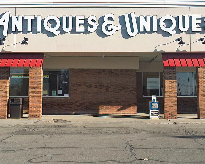 The unassuming storefront of Antiques & Uniques belies the wonderland of treasures waiting inside. Like a time machine disguised as a strip mall tenant.
