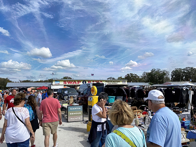Blue skies and bargain hunters converge at Swap-O-Rama, where Florida's treasure seekers navigate a sea of possibilities under perfect clouds.