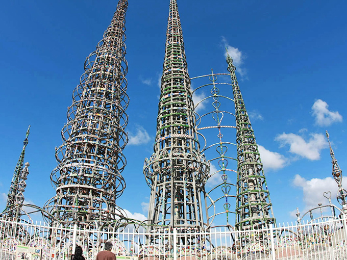 Reaching skyward like metallic giants playing freeze tag with the clouds, these remarkable spires showcase Simon Rodia's visionary craftsmanship at its finest.