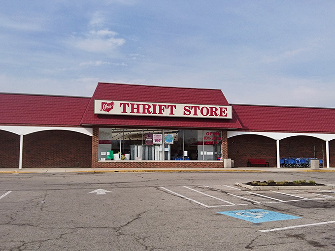 The iconic red roof of Ohio Thrift beckons like a beacon of bargain possibilities. Your wallet's happy place awaits inside.