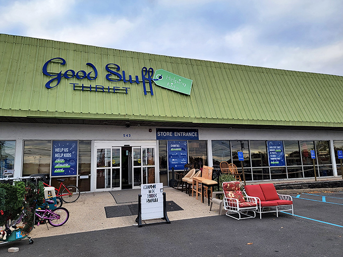 The green-roofed treasure chest beckons with its blue script sign, promising adventures in bargain hunting that'll make your wallet sing with joy.