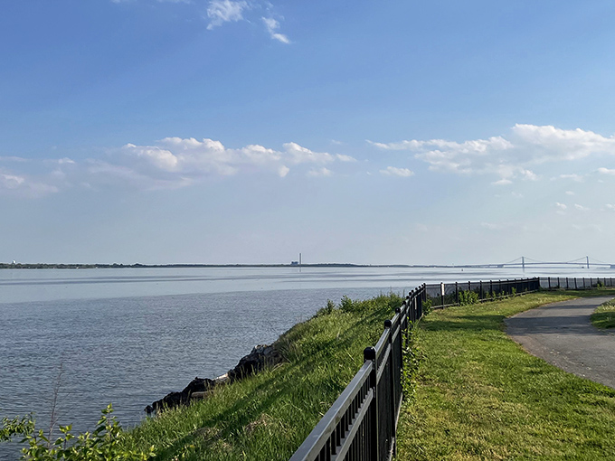 The Delaware River stretches toward infinity, with Fox Point's paved trail inviting you to follow its gentle curve. Nature's version of a welcome mat.