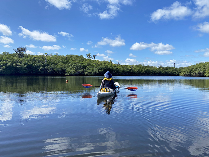 Serenity now! Gliding through the mirror-like waters of the Loxahatchee River feels like floating through nature's own meditation app. 
