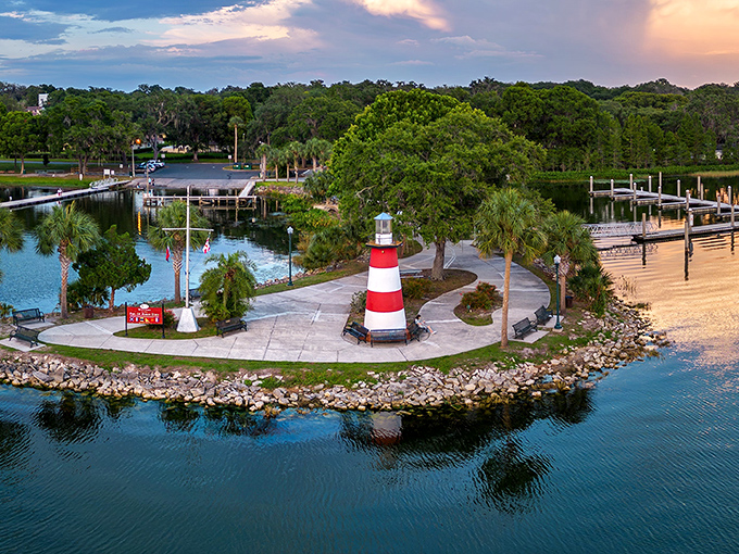 Mount Dora's iconic lighthouse stands sentinel over Lake Dora, proving Florida can do "quaint New England charm" while palm trees sway nearby.