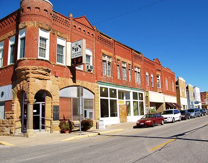 Historic brick buildings line Nauvoo's main street, where 19th-century architecture meets small-town charm in a scene straight from a Hallmark movie.