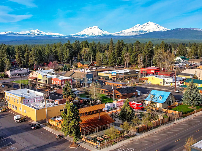 The view that makes house-hunters weep with joy: Sisters' downtown framed by the majestic Three Sisters mountains, nature's ultimate backdrop for small-town charm.