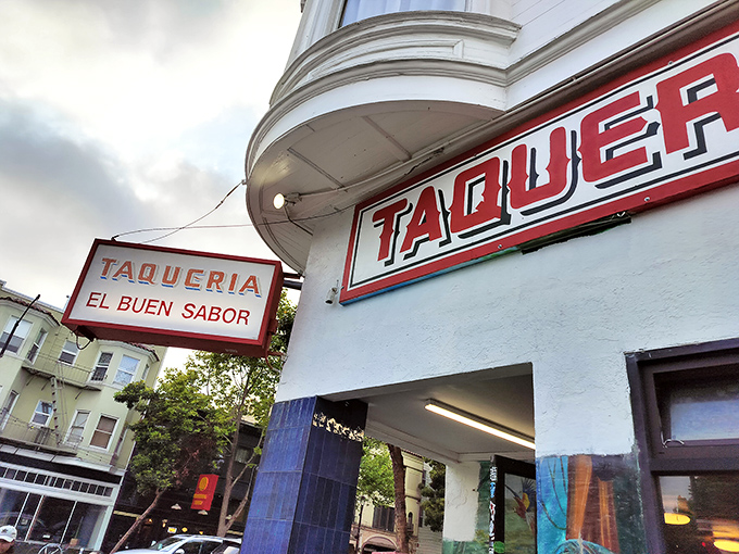 The corner spot that launched a thousand food debates. Taqueria El Buen Sabor's iconic red signage beckons hungry souls into Mission burrito paradise.