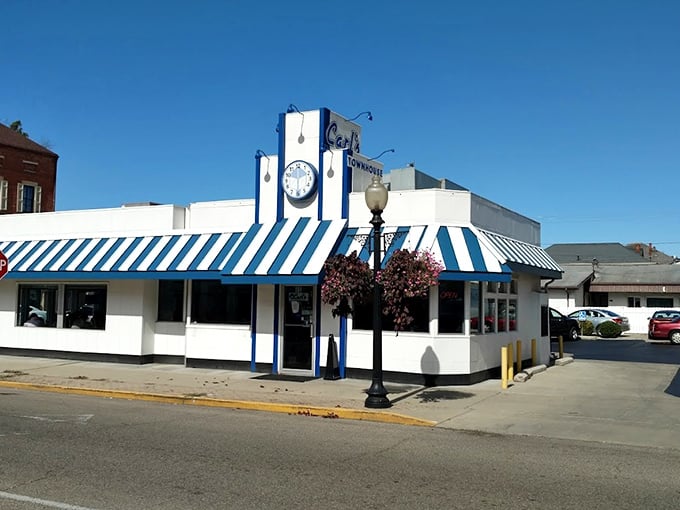 That iconic blue and white awning isn't just eye-catching&mdash;it's a time machine disguised as a diner, beckoning hungry travelers with promises of comfort food perfection.
