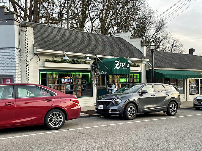 The unassuming storefront of Zip's Cafe stands proudly on Mount Lookout Square, its green awning like a beacon for burger enthusiasts seeking authentic Cincinnati comfort food.