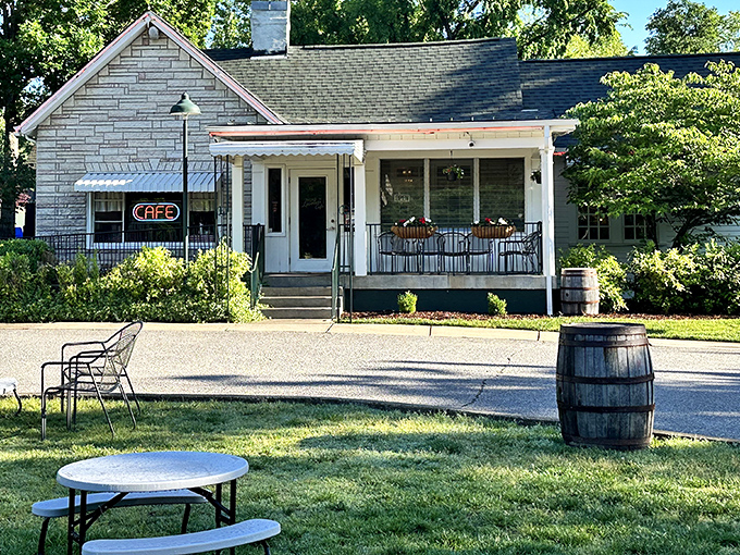 The charming exterior of Loveless Cafe welcomes visitors with its quaint porch and rustic barrel&mdash;Southern hospitality before you even step inside.