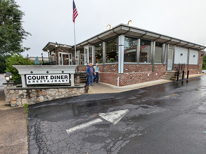 The classic brick and stone exterior of Court Diner stands proudly in Media, complete with American flag &ndash; a beacon of breakfast hope for hungry Pennsylvanians.