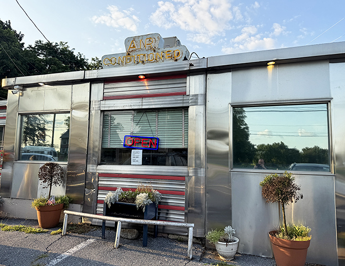 The gleaming stainless steel exterior of Route 30 Diner shines like a beacon for hungry travelers, promising classic American comfort in every bite.