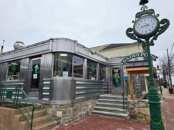 The classic stainless steel exterior of Daddypops stands like a time machine to better breakfasts, complete with that iconic green clock keeping diner time.