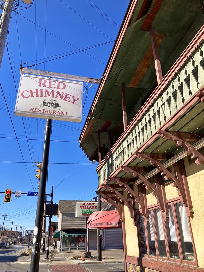 The iconic Red Chimney sign stands like a time capsule against Cleveland's blue sky, beckoning hungry travelers to this Slavic Village treasure.