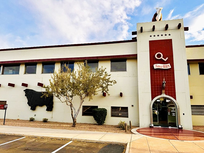 The iconic white exterior with its distinctive cow silhouette announces you've arrived somewhere special. Arizona's cattle heritage in architectural form.