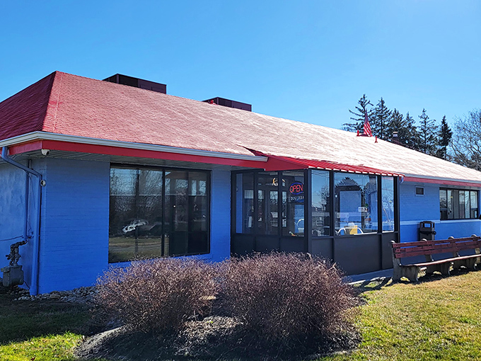 The bright blue exterior with its cherry-red roof stands like a beacon of comfort food promise on Wilmington's landscape.