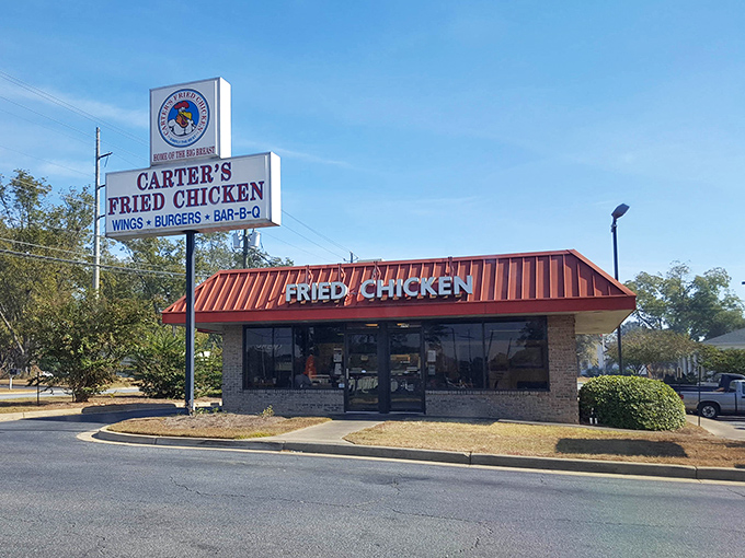 The iconic red roof of Carter's Fried Chicken stands like a beacon of hope for hungry travelers. Southern comfort food paradise awaits inside!
