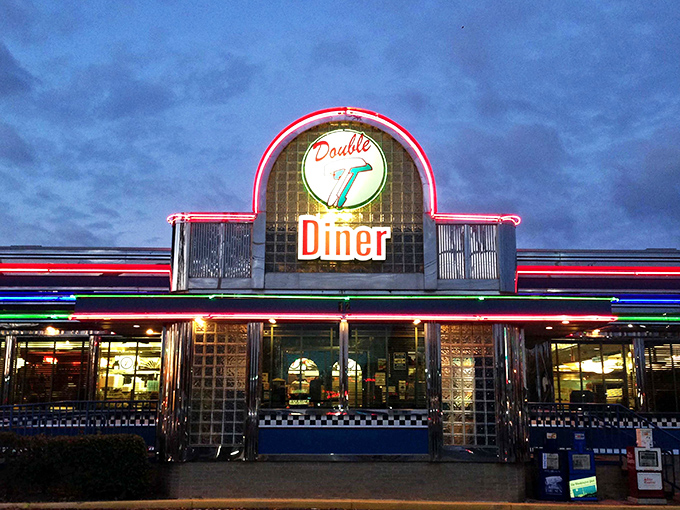 Neon dreams come true at Double T Diner, where the glowing sign beckons hungry travelers like a lighthouse for the famished. The classic Americana exterior promises comfort inside.