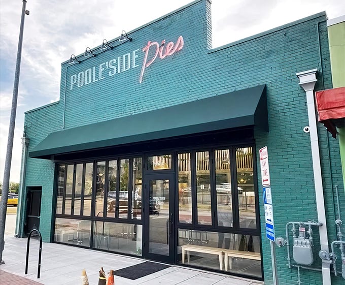 The iconic turquoise exterior of Poole's beckons like a culinary lighthouse in downtown Raleigh, promising unforgettable meals within.