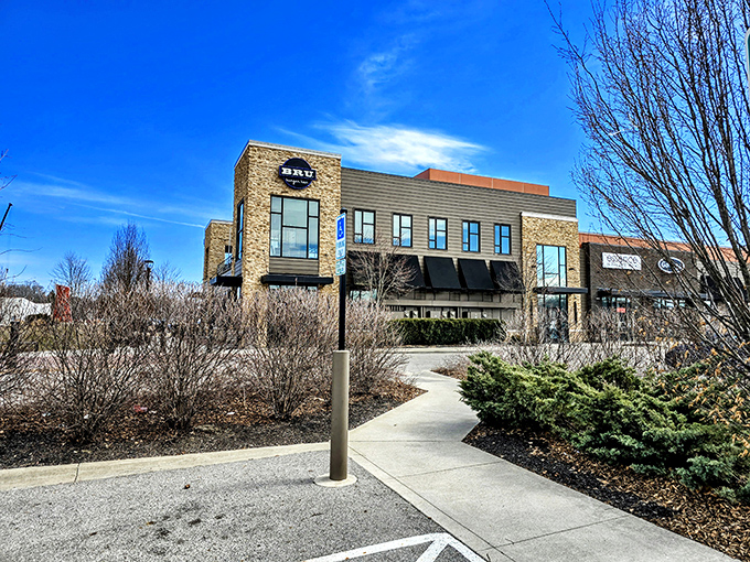 The modern stone façade of Bru Burger Bar stands like a culinary lighthouse in Westerville, beckoning hungry travelers with promises of gourmet comfort food.