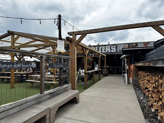 Rustic wooden beams, string lights, and stacked firewood &ndash; Walter's outdoor entrance isn't just welcoming, it's practically whispering "come get comfortable" in your ear.