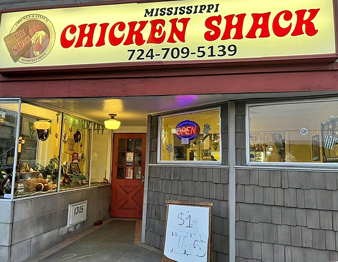 The red and white sign beckons like a lighthouse for hungry souls. Ms Chicken Shack's unassuming storefront hides culinary treasures within.