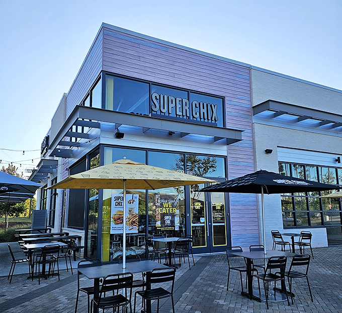 Super Chix's modern exterior with those cheerful yellow umbrellas isn't just inviting&mdash;it's practically waving you in for a chicken revelation.