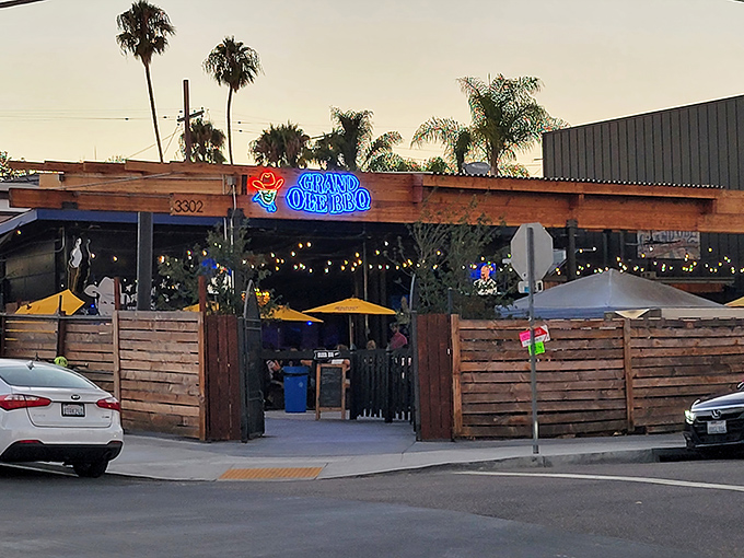 Rustic wooden beams, corrugated metal roofing, and string lights create that perfect "I've discovered something special" vibe at Grand Ole BBQ's inviting exterior.