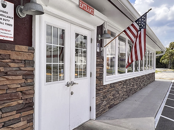 The unassuming exterior of Backyard Boys BBQ hides a smoky paradise within. Like finding a treasure map in your junk drawer&mdash;unremarkable until you realize what it leads to.