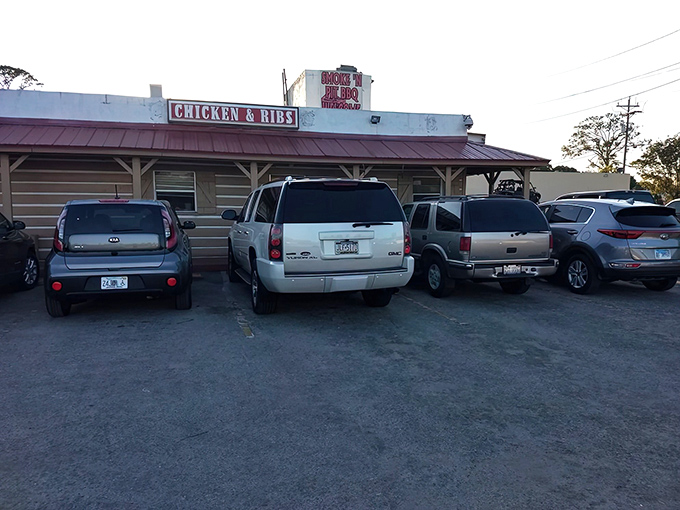 The unassuming wooden exterior of Smoke'n Pit screams "authentic barbecue inside!" Those rooftop signs aren't lying&mdash;this place means serious meat business.